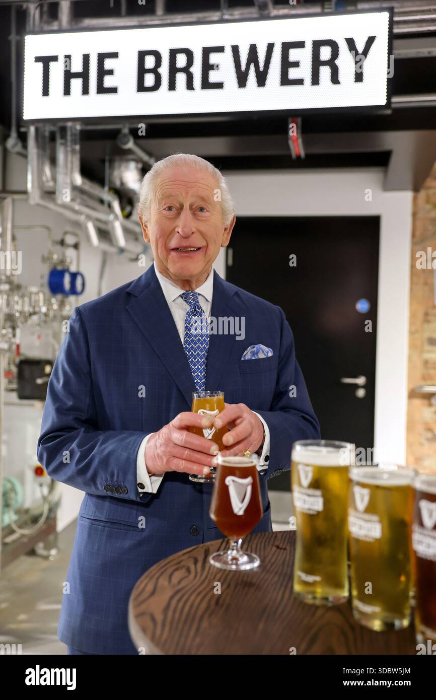 King Charles III tastes a Guinness during a visit to officially open ...