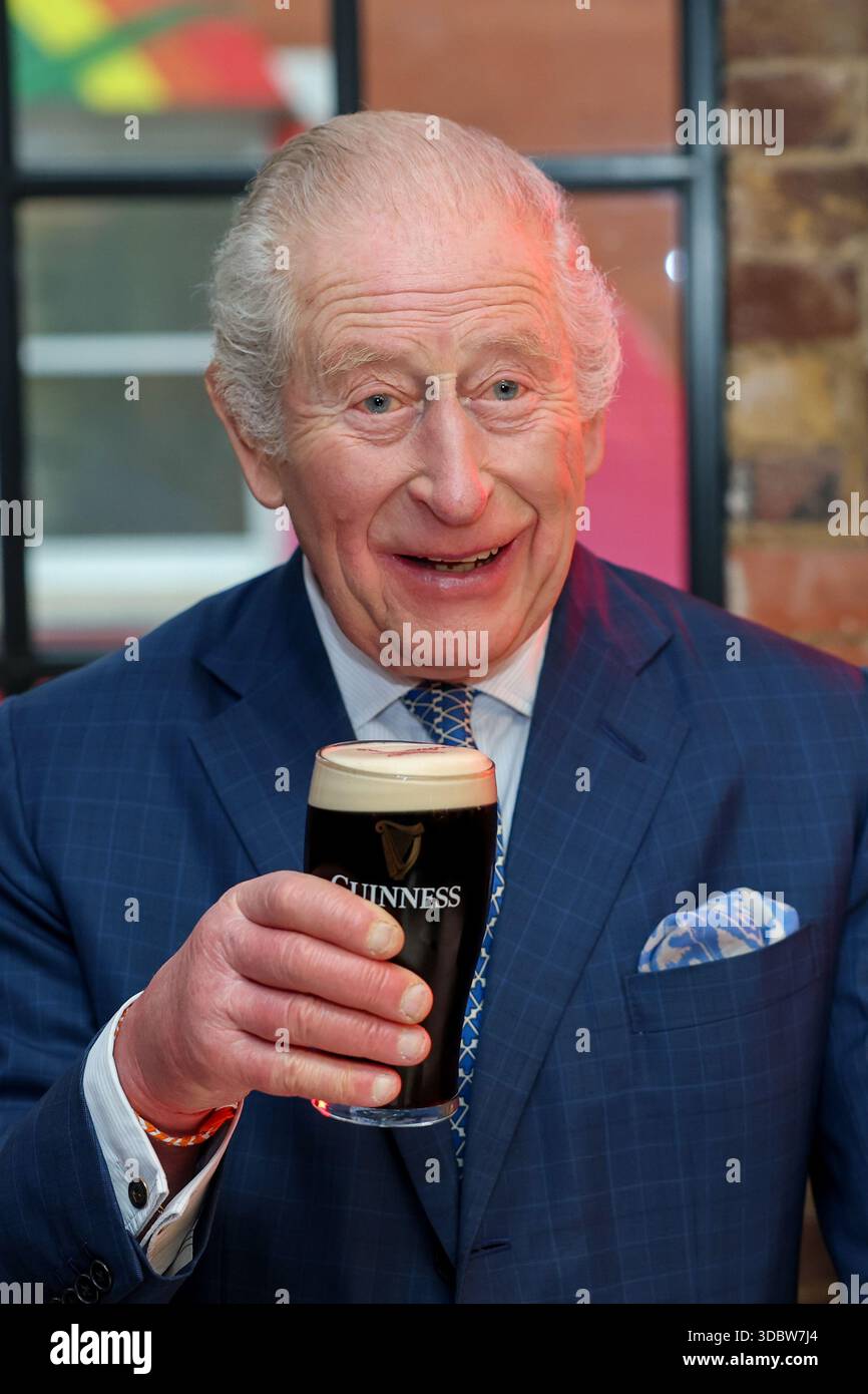 King Charles III tastes a pint of Guinness during his visit to the ...