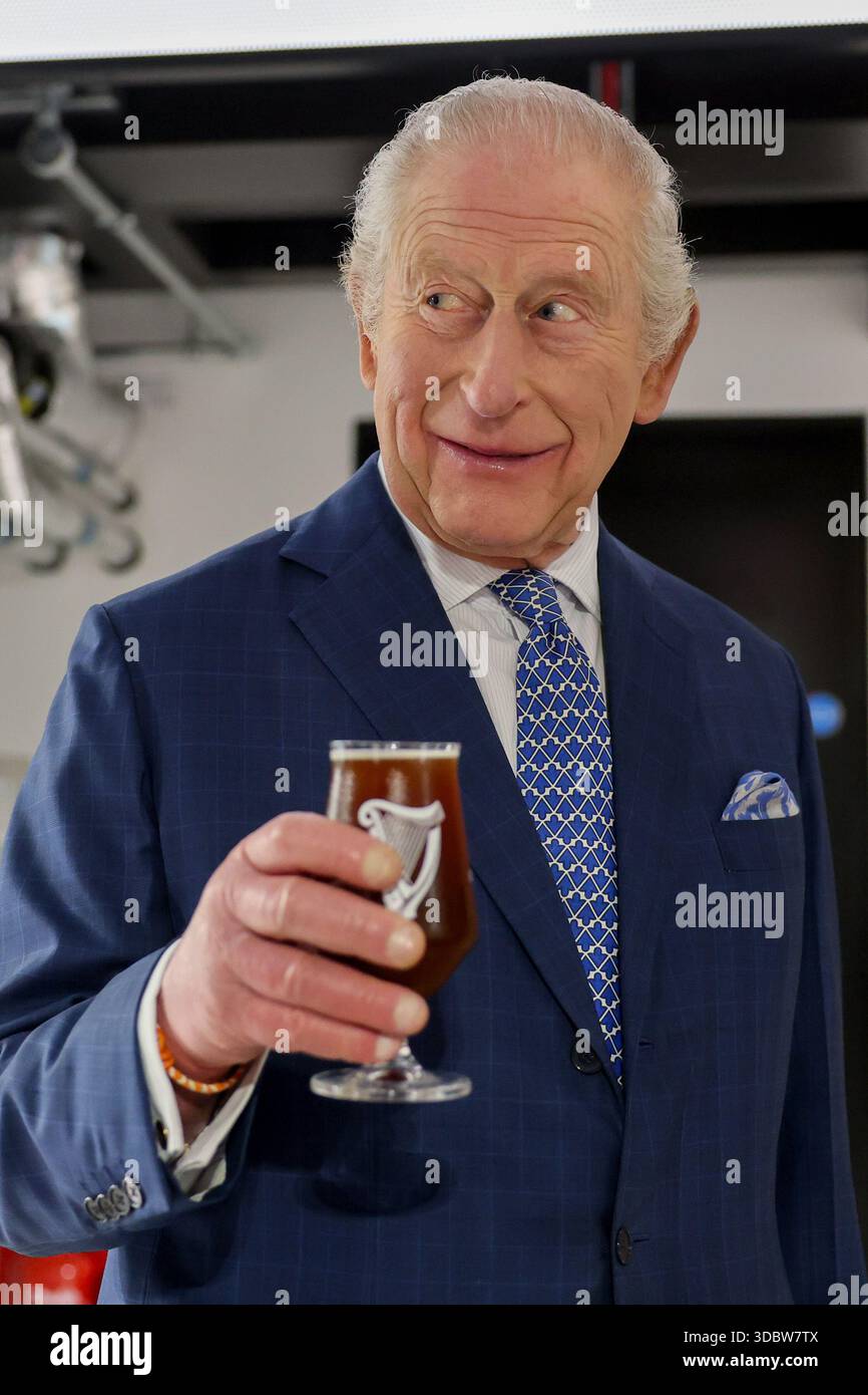 King Charles III tastes a pint of Guinness during his visit to the ...