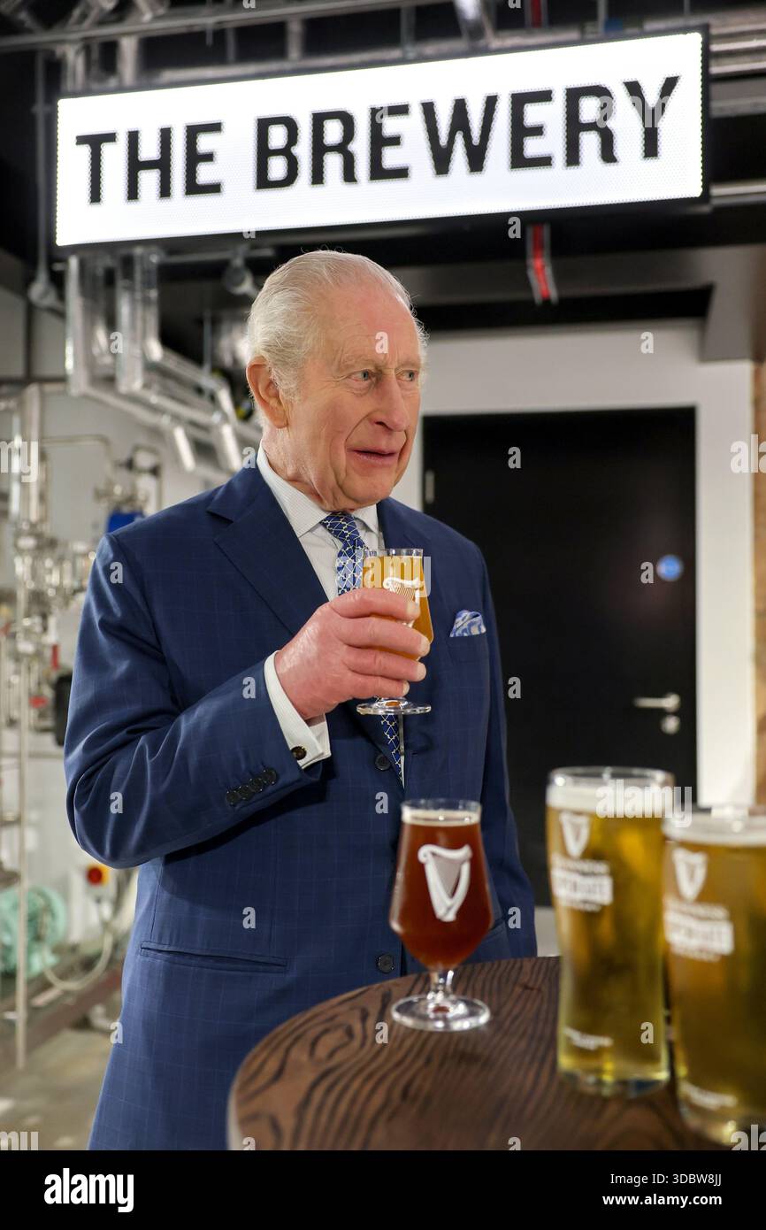King Charles III tastes a pint of Guinness during his visit to the ...