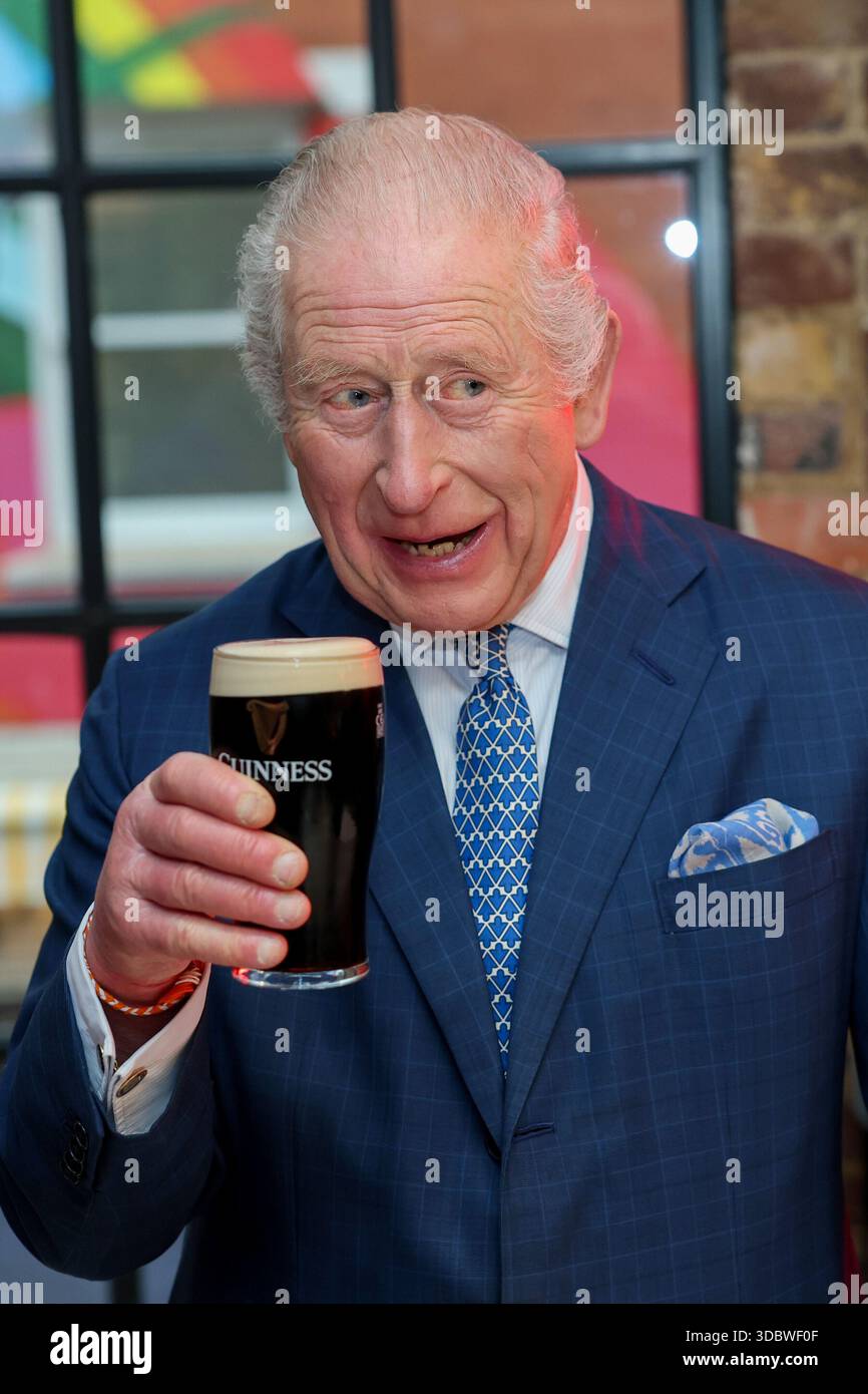 Britain's King Charles III tastes a Guinness during his visit to ...