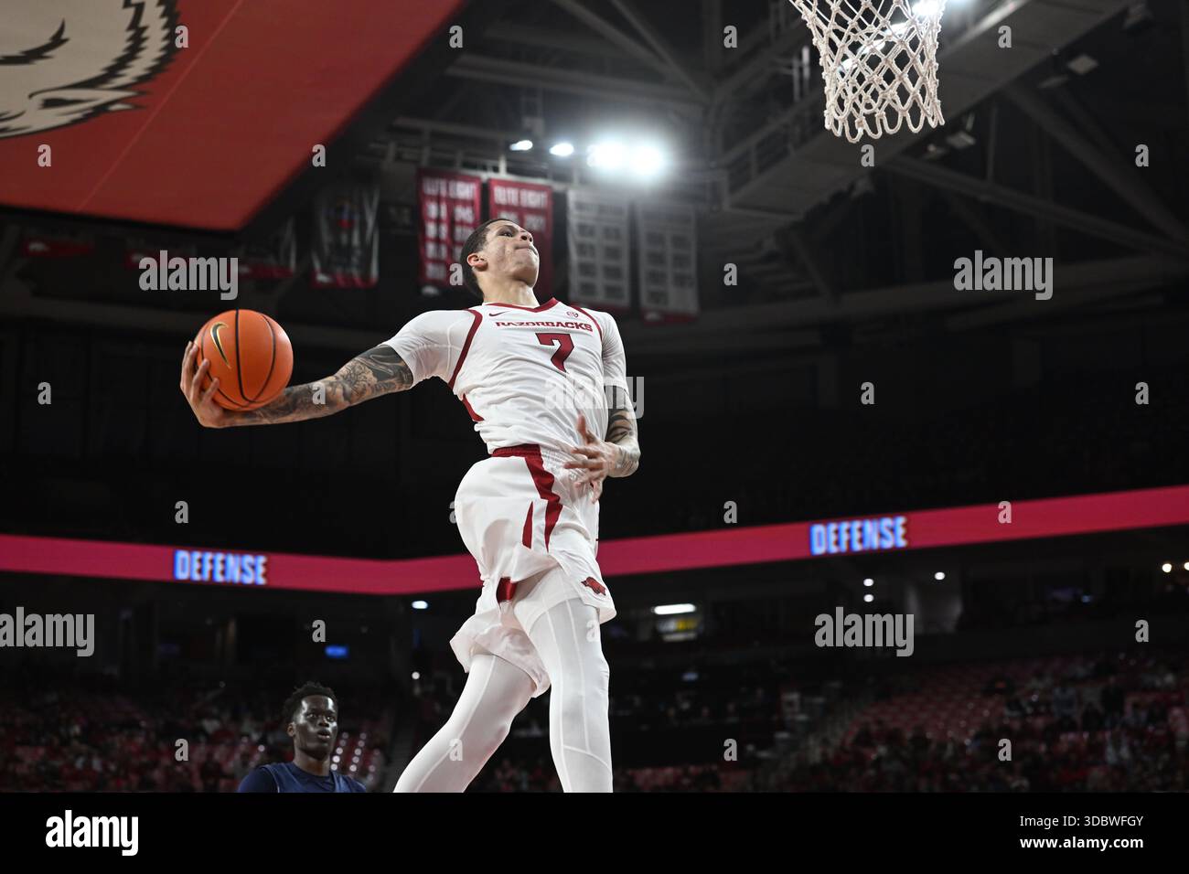 Arkansas forward Trevon Brazile (7) drives to the basket against Queens ...