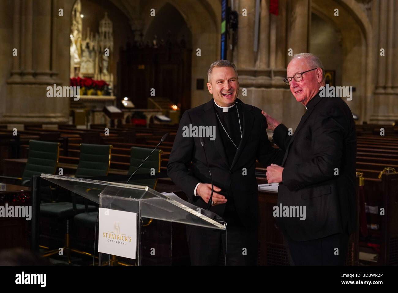 New York archbishop, Timothy Dolan greets Bishop Ronald Hicks during a ...