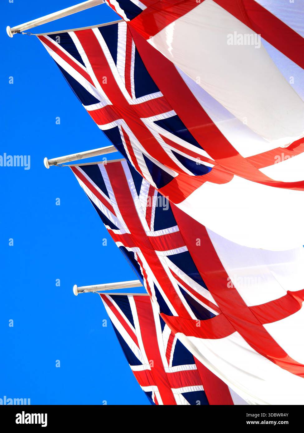 White ensign flags with Union Jack canton flying on poles at Admiralty ...