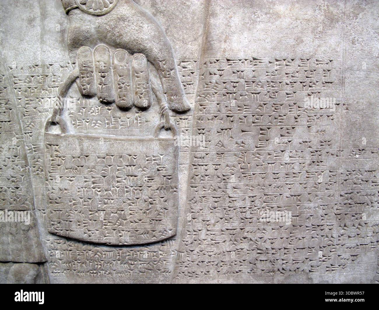 Assyrian relief 865-860 BC showing a sculpture carving of cuneiform ...