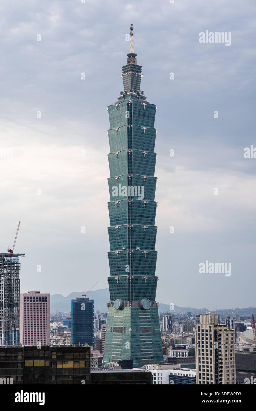 Aerial view of Taipei 101 skyscraper piercing the skyline with its ...