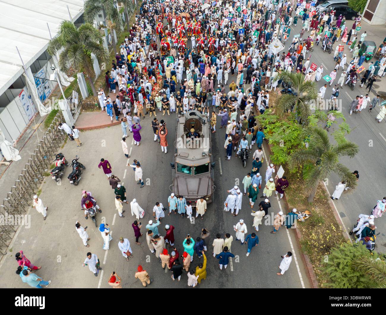 Aerial view of a military vehicle moving through a densely packed ...