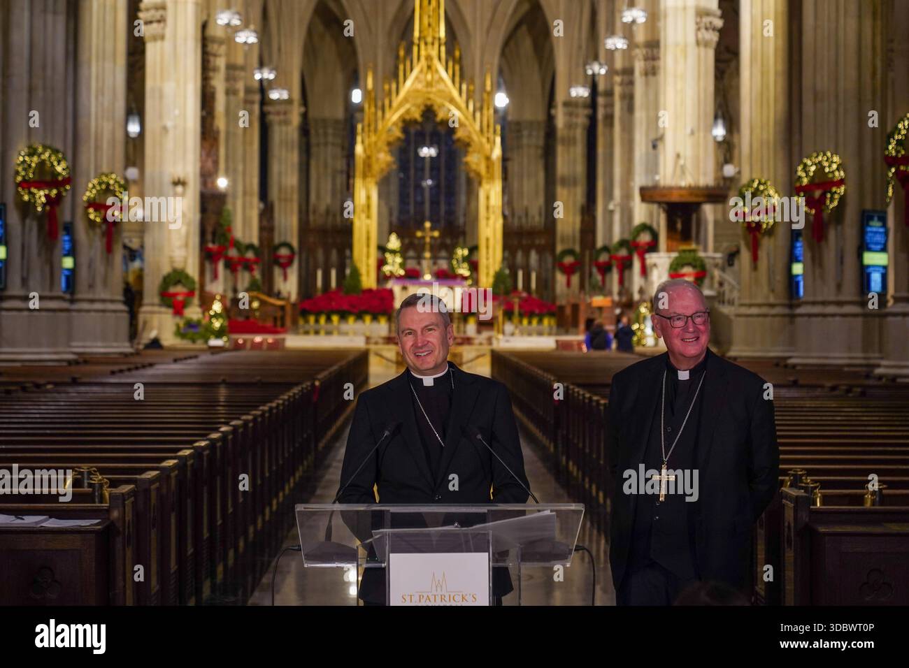 New York archbishop Timothy Dolan greets Bishop Ronald Hicks during a ...