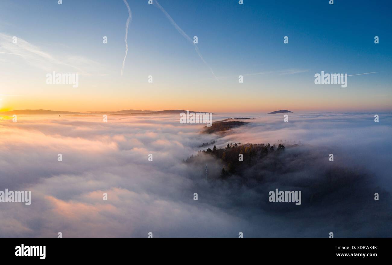 Aerial view of ethereal clouds blanketing the forest below Burg ...