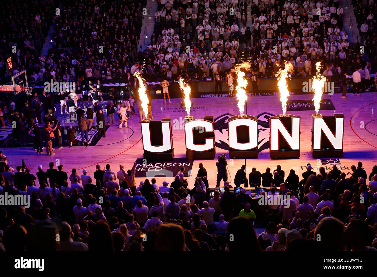 UConn's Alex Karaban, left, is introduced at PeoplesBank Arena is seen ...