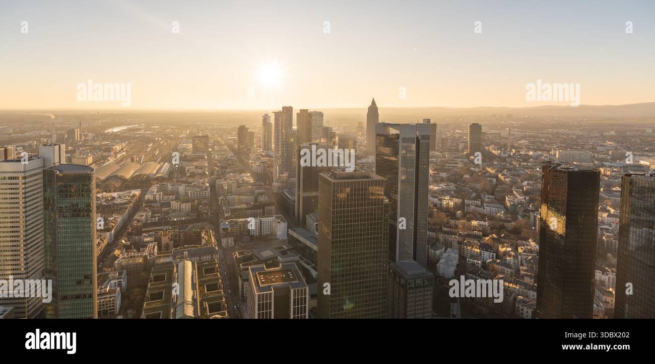 Aerial view of golden light kissing the towering skyscrapers and the ...