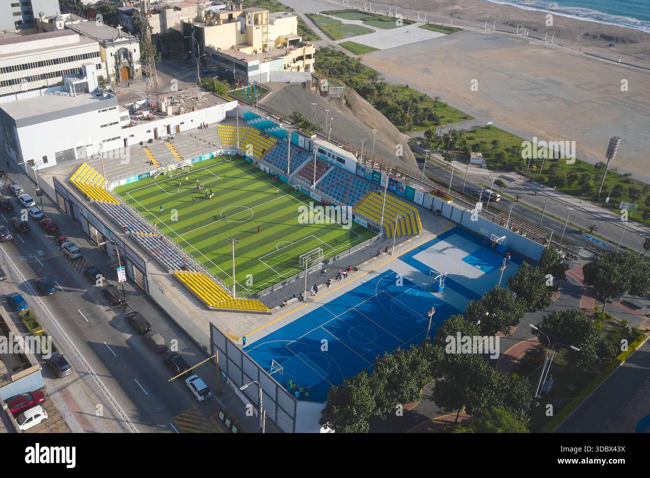 Aerial view showing a sports complex with a soccer field and basketball ...
