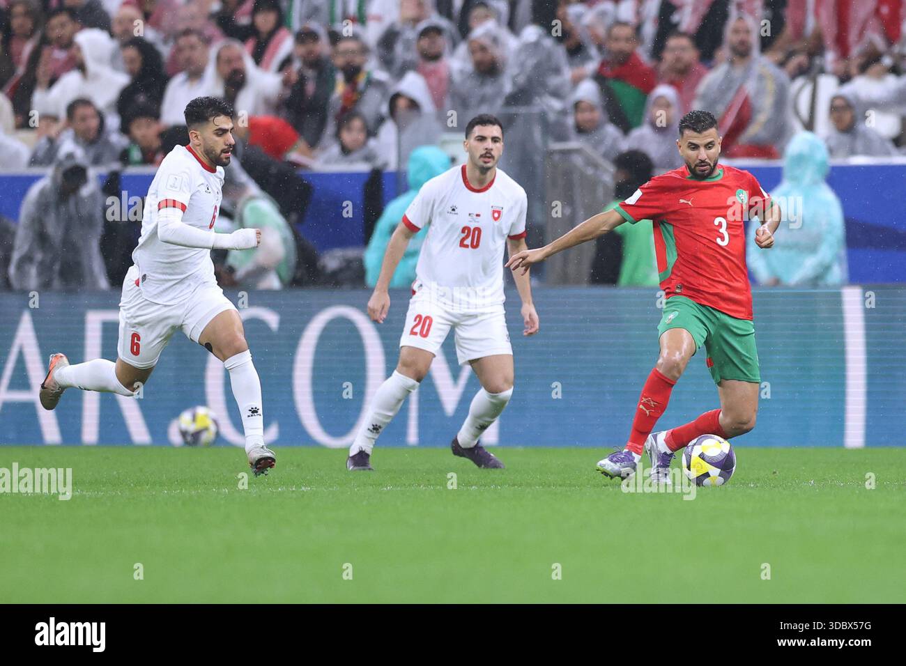 Morocco's Anas Bach, right, vies for the ball with Jordan's Amer Jamous ...