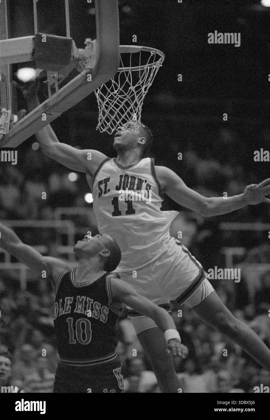 St. John's Jayson Williams goes for a basket past Ole Miss player John ...