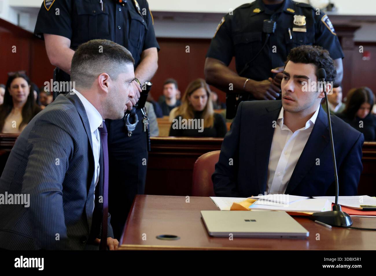 Luigi Mangione confers with his attorney, Jacob Kaplan, as he appears ...