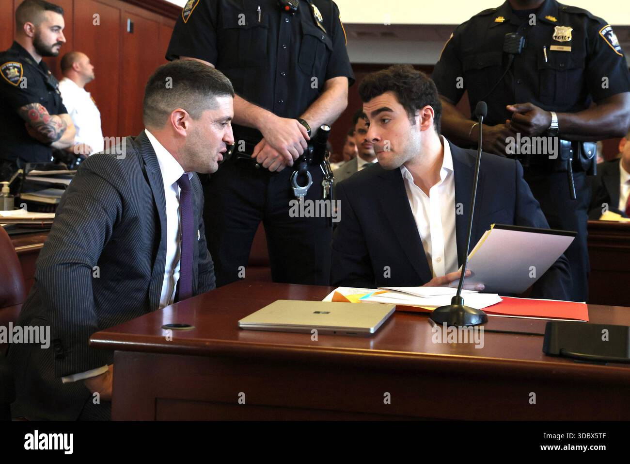 Luigi Mangione confers with his attorney, Jacob Kaplan, as he appears ...