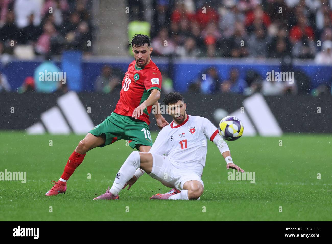 Jordan's Issam Smeeri, right, tussles for the ball with Morocco's Amin ...