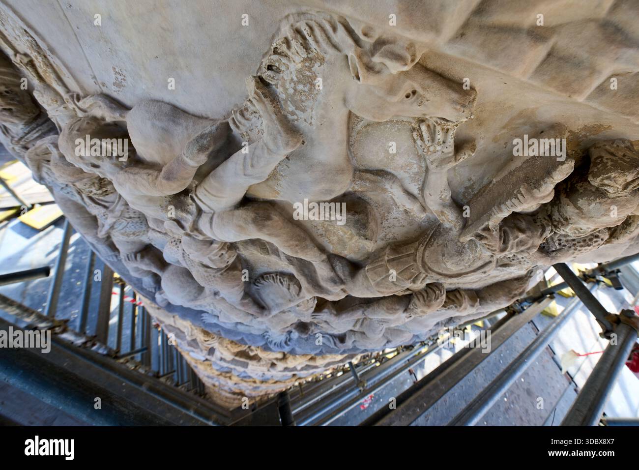 Bas-reliefs depicting scenes from a battle are seen on the second ...