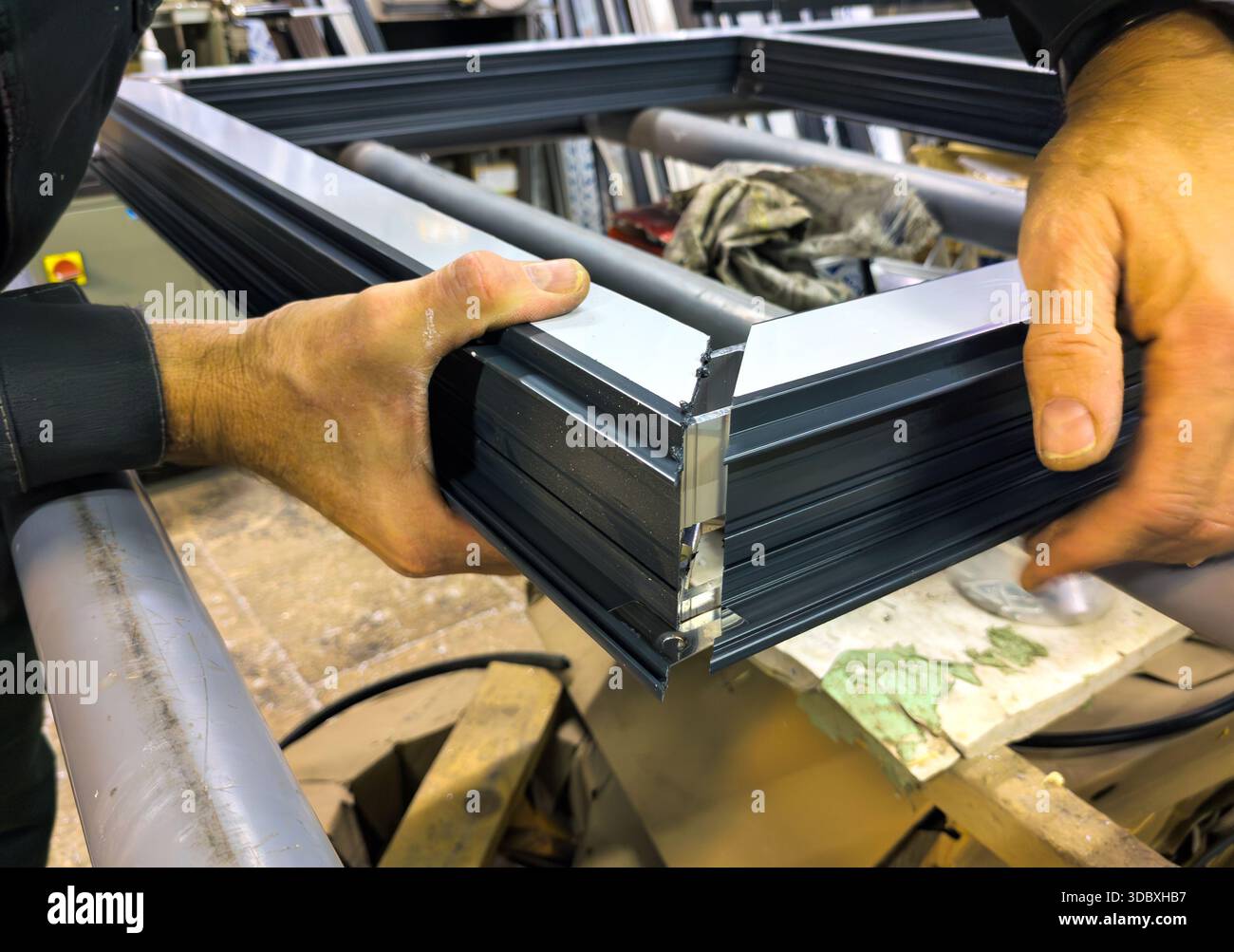 Assembling a window frame from an aluminum profile Stock Photo - Alamy