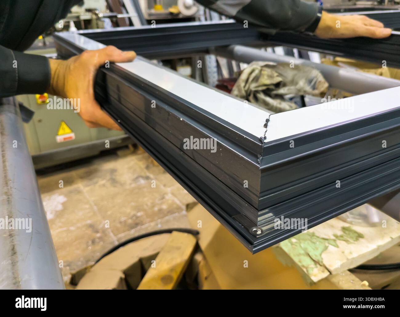 Assembling a window frame from an aluminum profile Stock Photo - Alamy