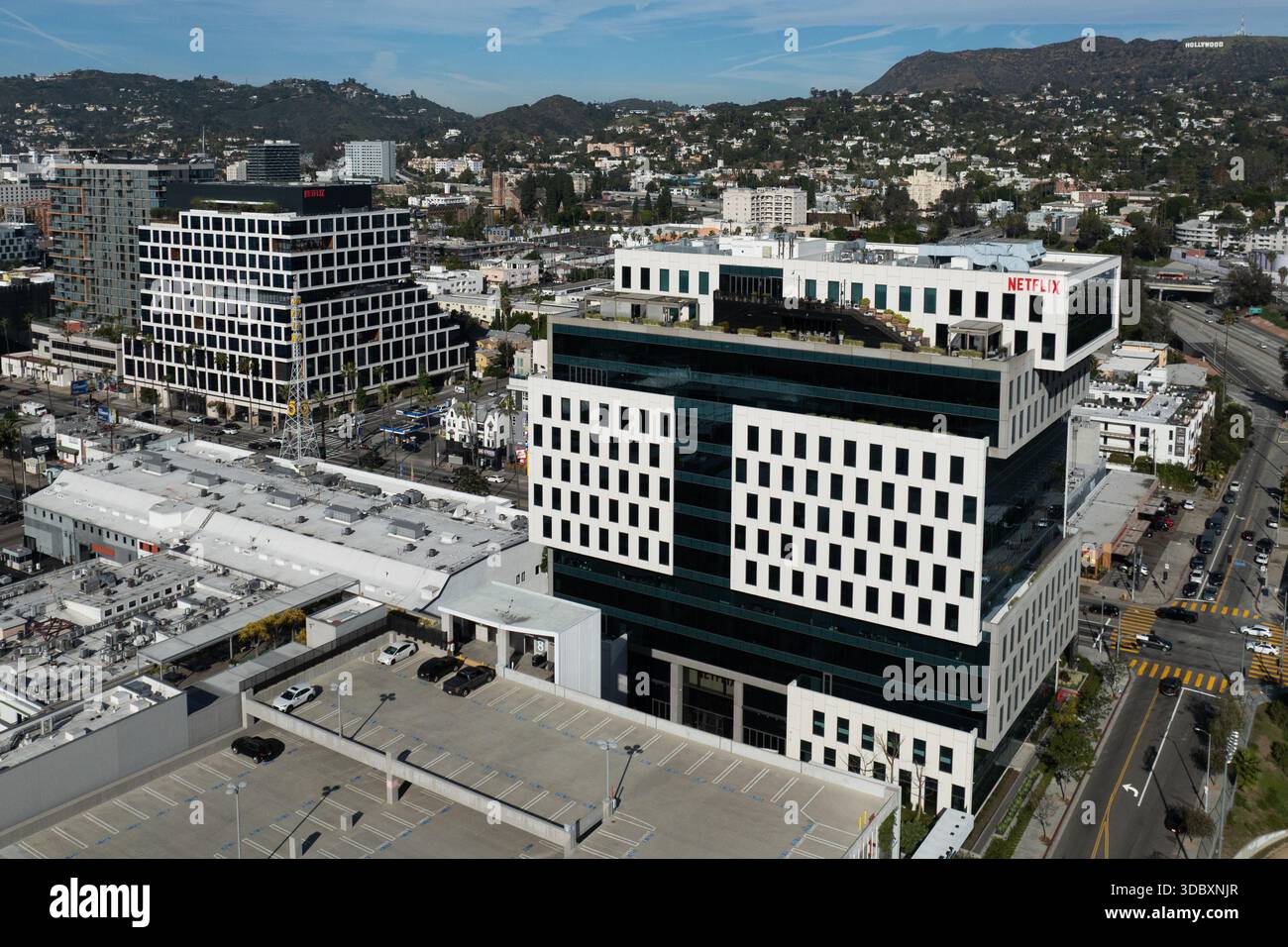 Netflix signs are displayed atop buildings in Los Angeles, Thursday ...