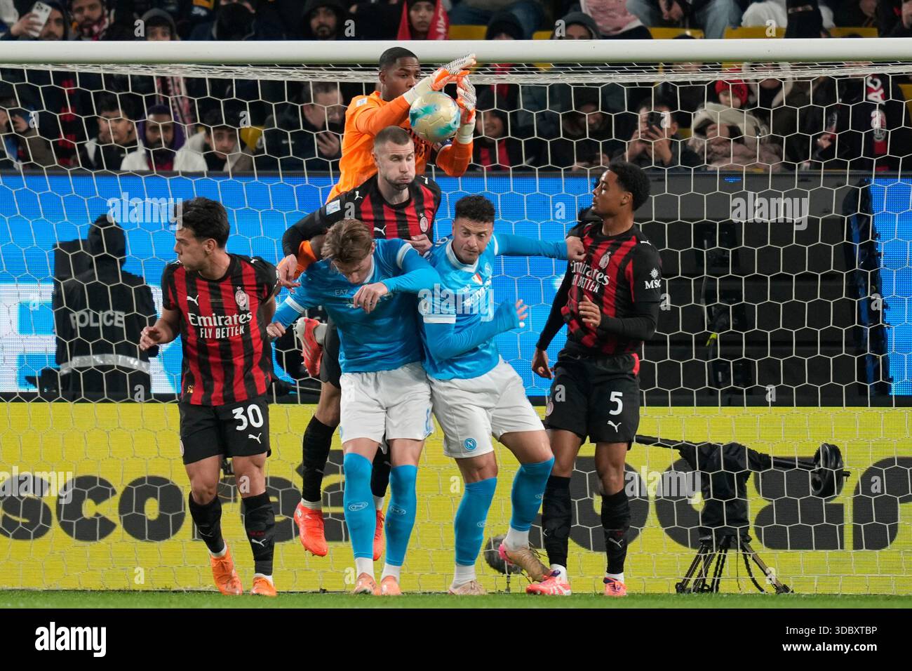 AC Milan's goalkeeper Mike Maignan saves during an Italian Super Cup ...