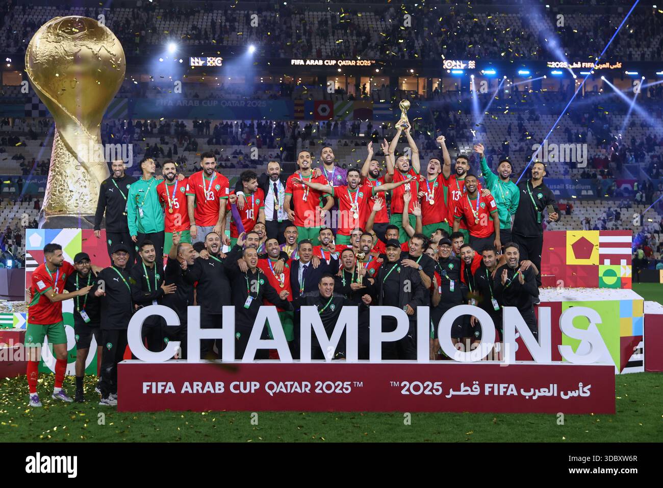 Morocco's players celebrate with the winner trophy after defeating ...
