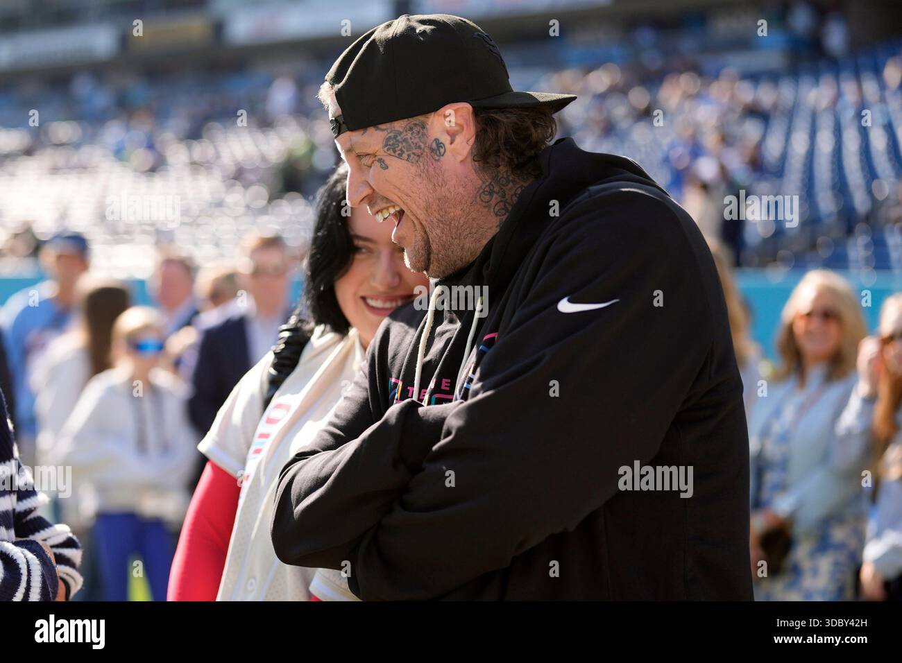 FILE - Entertainer Jelly Roll talks on the sidelines before an NFL ...