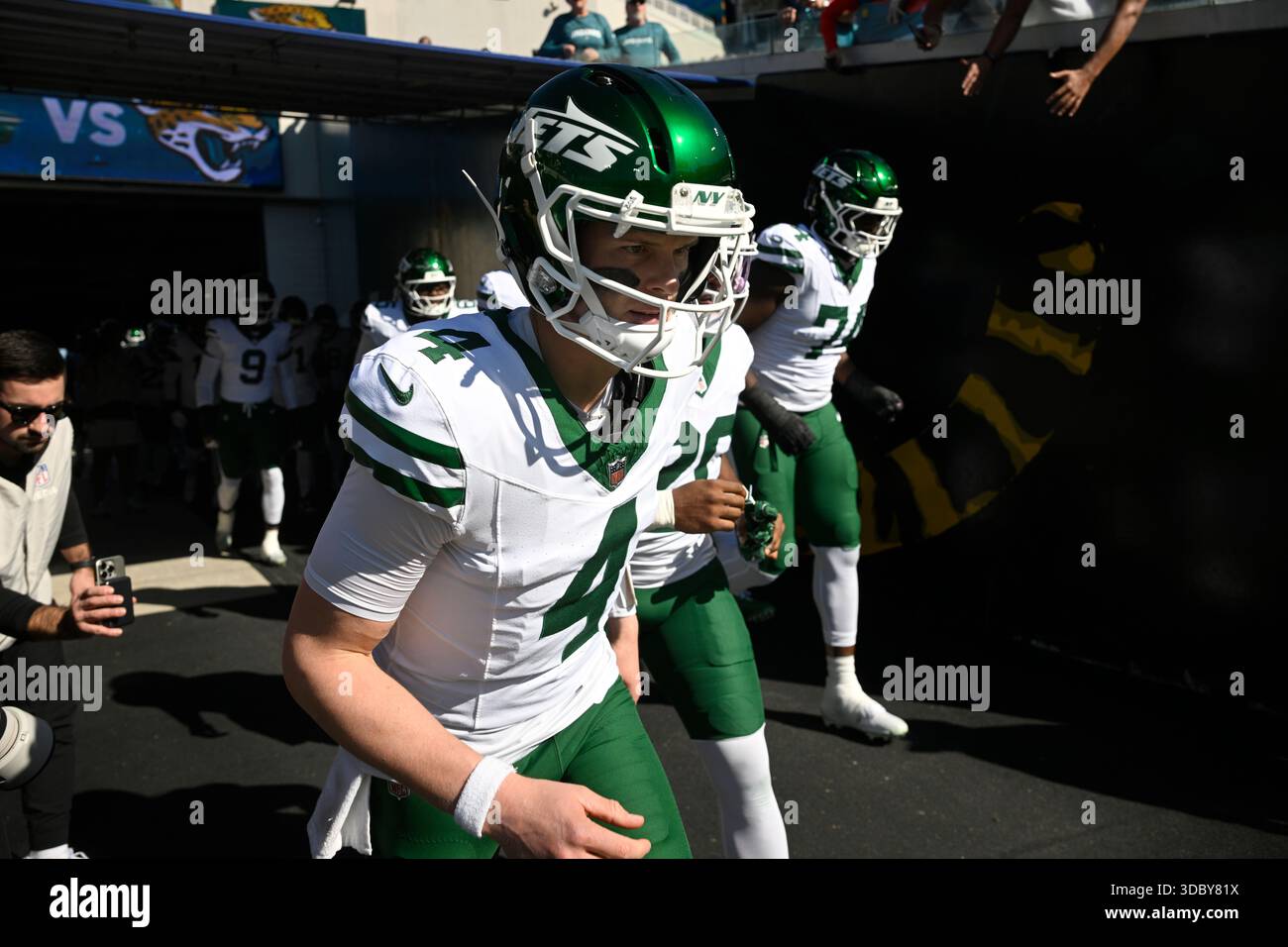 New York Jets quarterback Brady Cook (4) heads to the field with ...