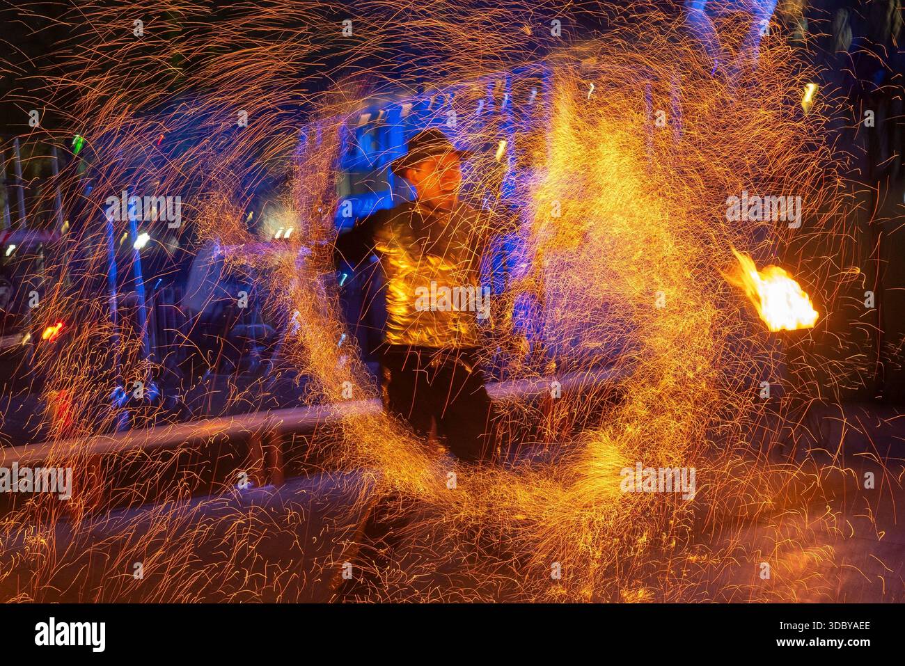 An artist performs with fire during the Jewish holiday of Hanukkah at ...