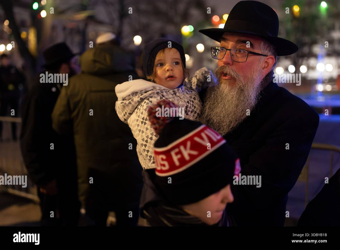 Rabbi Sholom Krinsky participates in the Hanukkah celebration at the ...