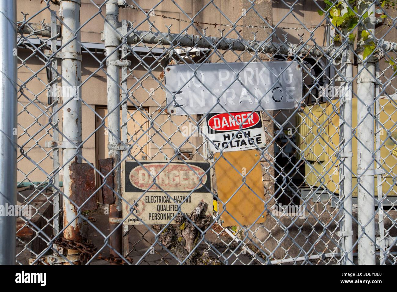 Washington, DC - Signs on a locked gate warn of high voltage and ...