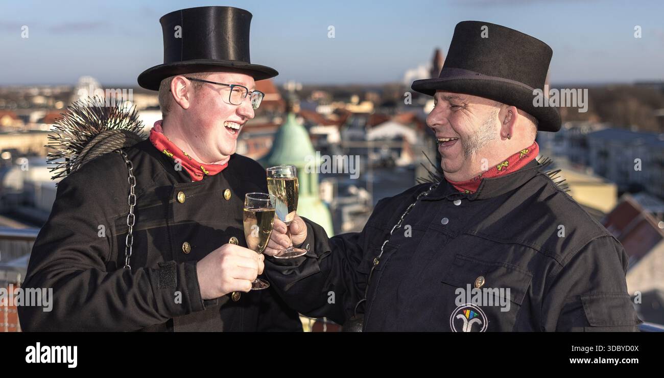 11 December 2025, Brandenburg, Cottbus: Chimney sweeps Niklas Schuppan ...