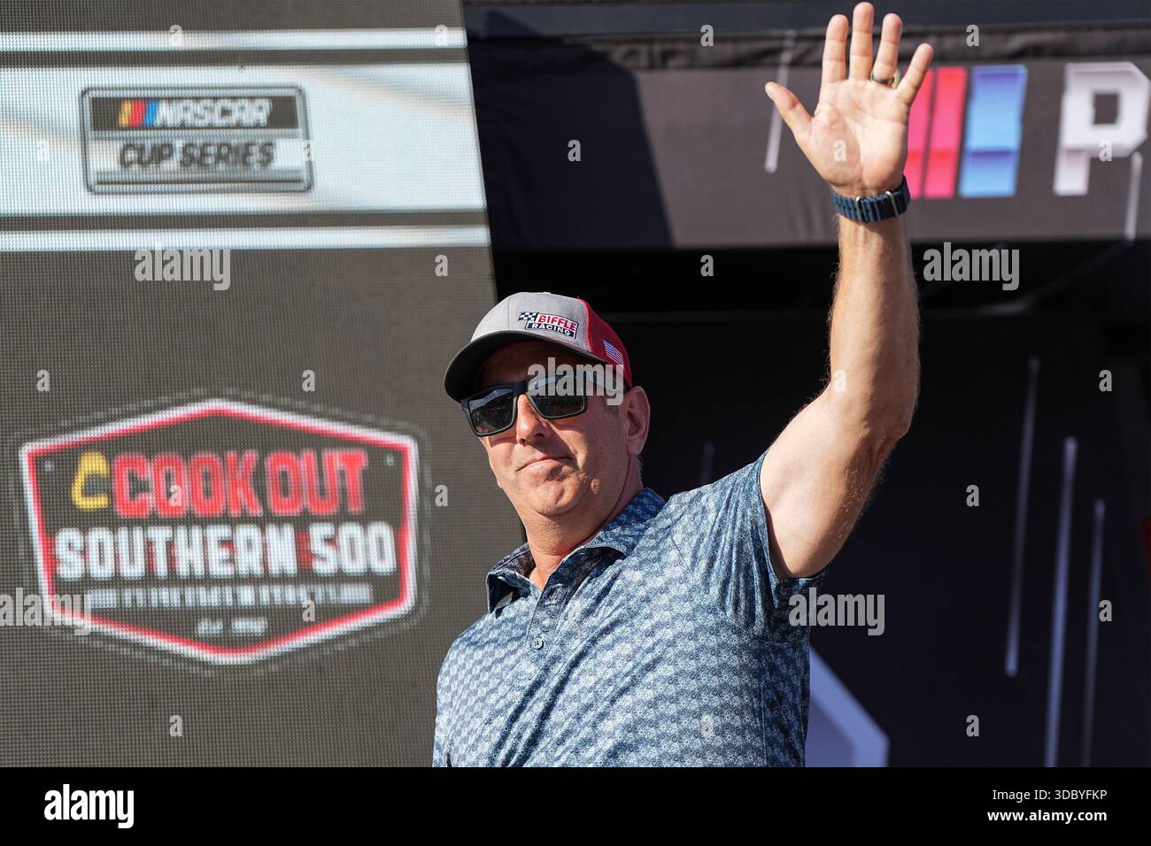 FILE - Former driver Greg Biffle waves to fans prior to a NASCAR Cup ...