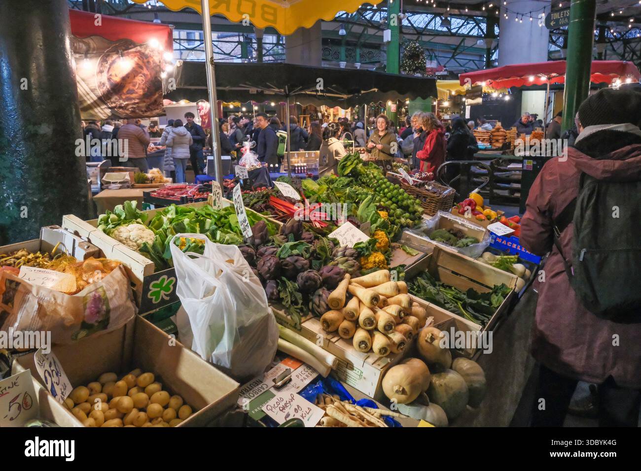 London, UK. 18th December 2025. Fruit and vegetable stalls at Borough ...