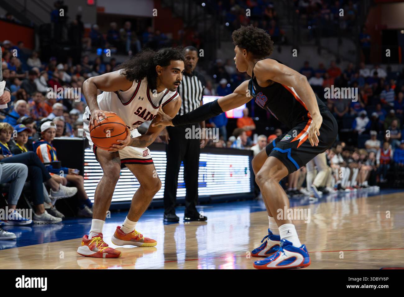 Saint Francis guard/forward Skylar Wicks (left) looks for a way around ...