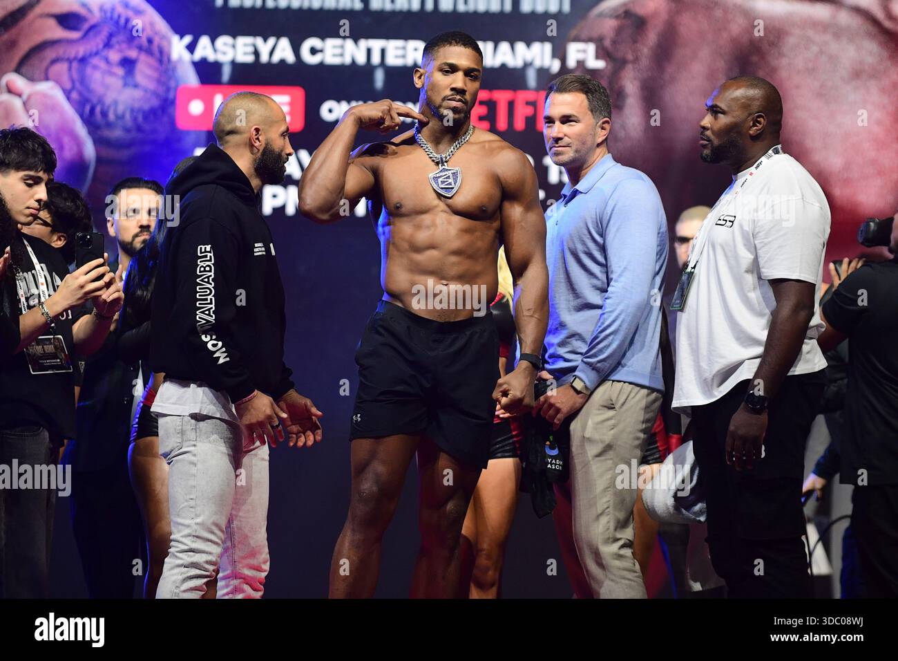 Anthony Joshua makes a throat slash gesture during the official weigh ...