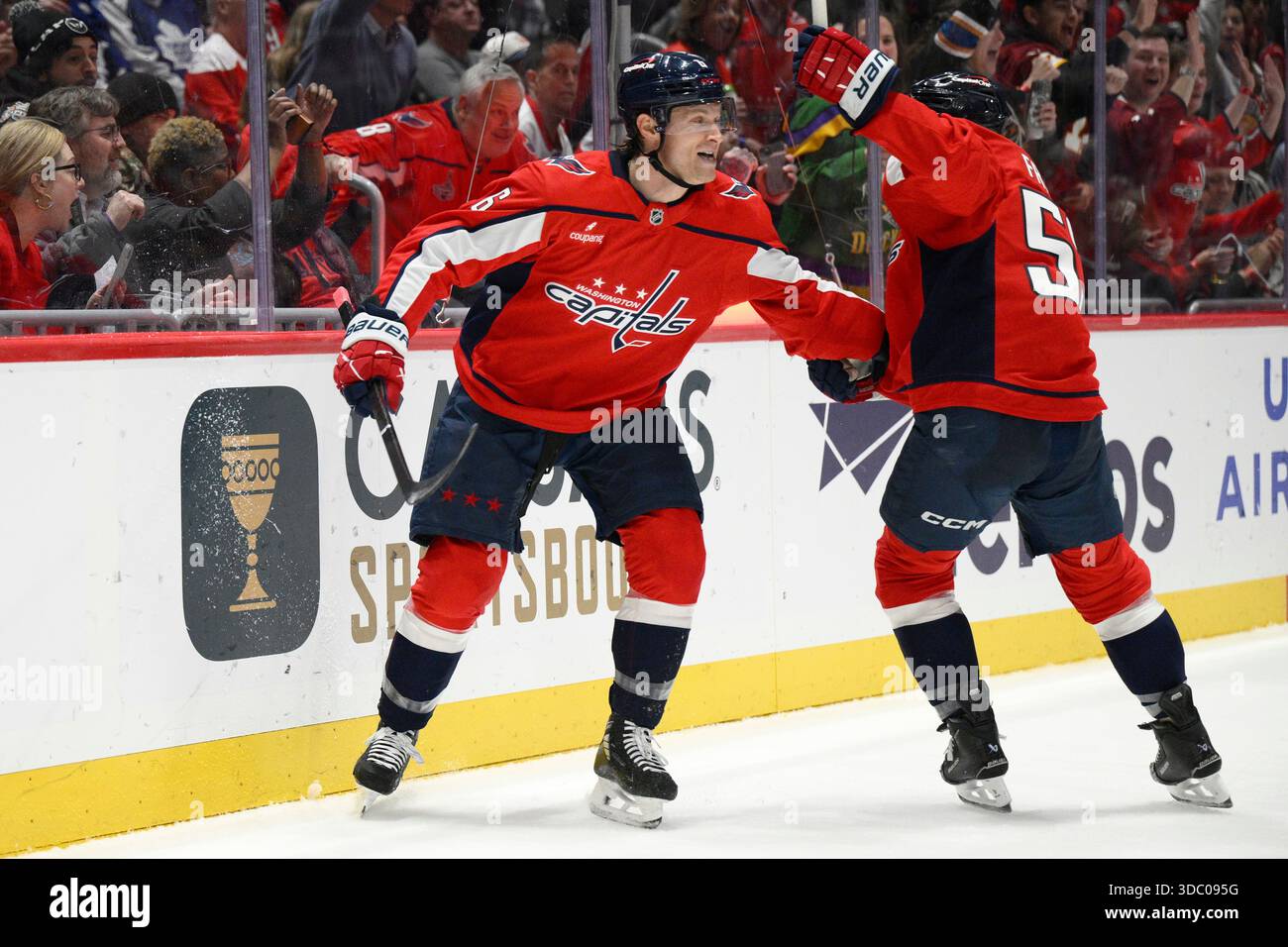 Washington Capitals defenseman Jakob Chychrun, left, celebrates his ...