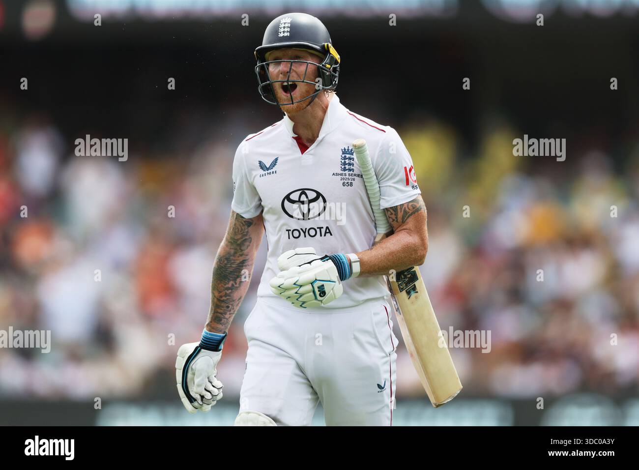 England's Ben Stokes reacts after he was out bowled during play on day ...