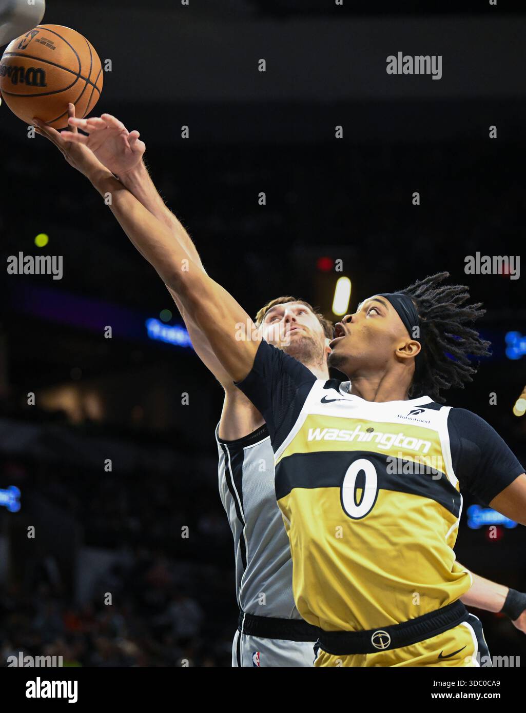 Washington Wizards guard Bilal Coulibaly (0) drives for a layup against San Antonio Spurs center ...