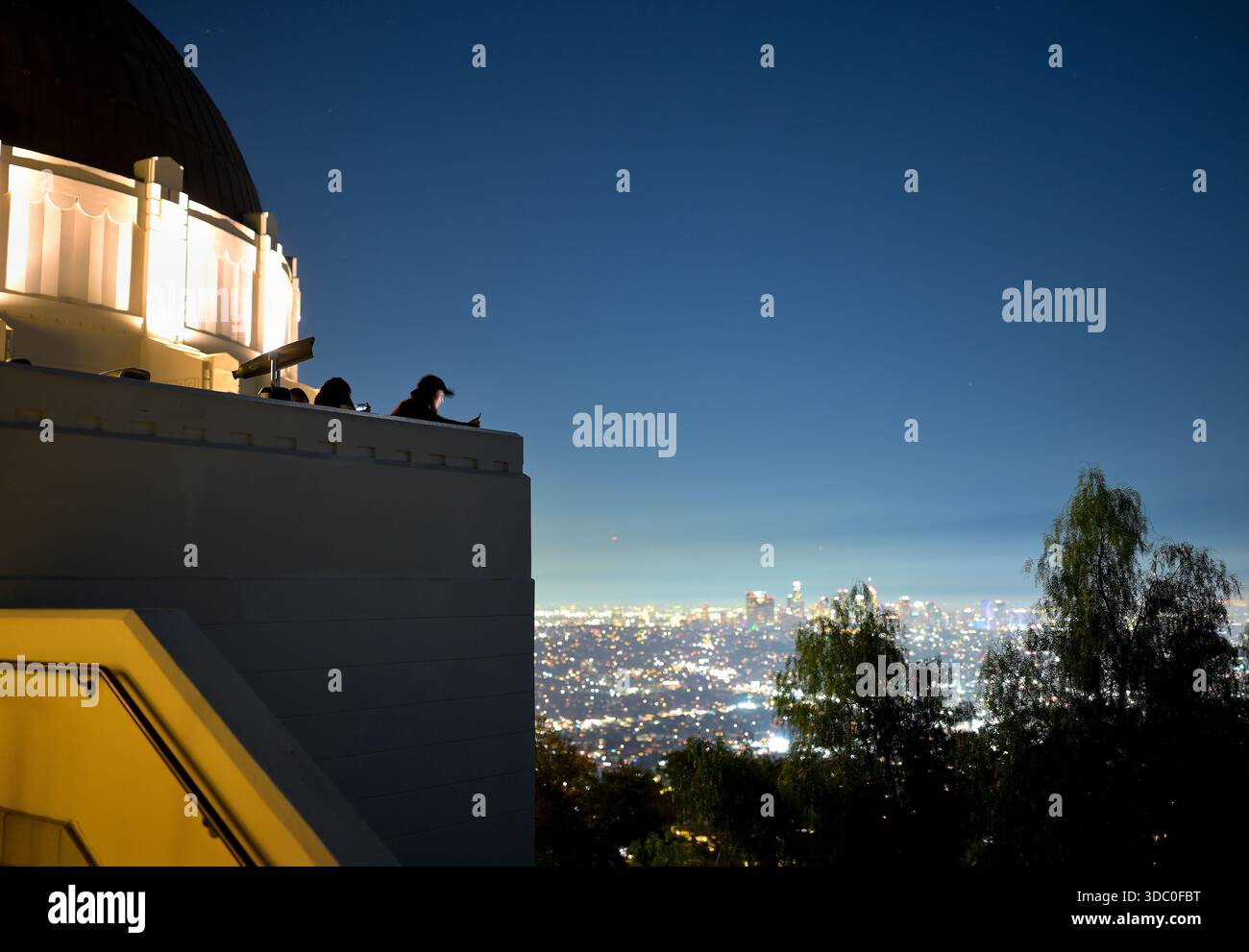 An evening at the iconic Griffith Observatory overlooking the megacity ...