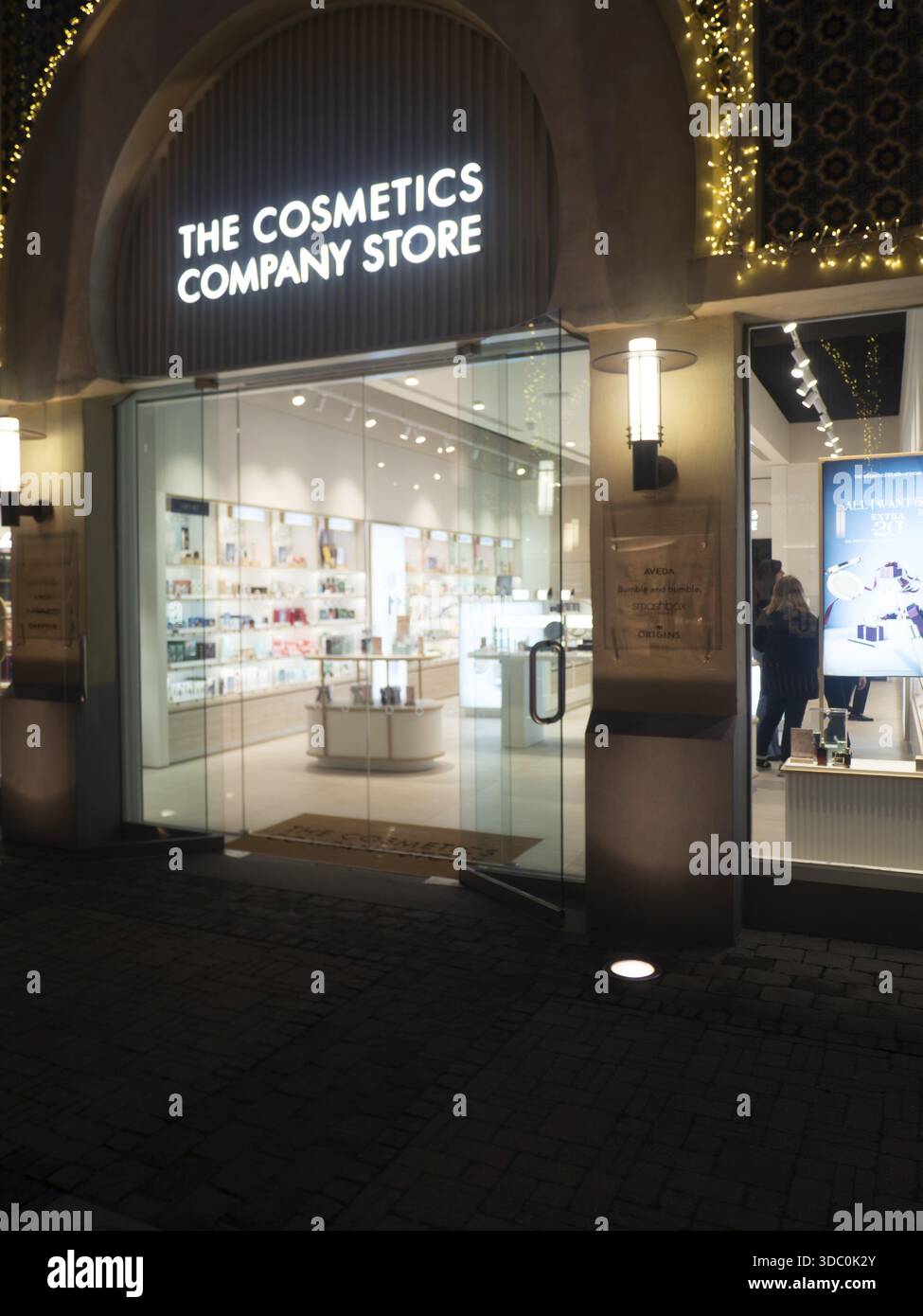 Cosmetic store with bright interior lighting and a modern facade at ...