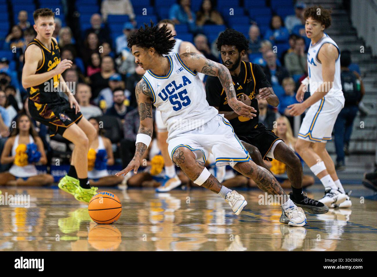 UCLA Bruins guard Skyy Clark (55) is defended by Arizona State Sun ...