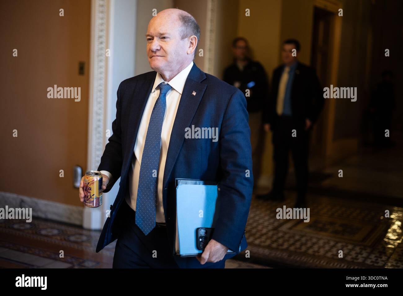 Sen. Chris Coons (D-Del.) is seen at the U.S. Capitol Dec. 18, 2025 ...