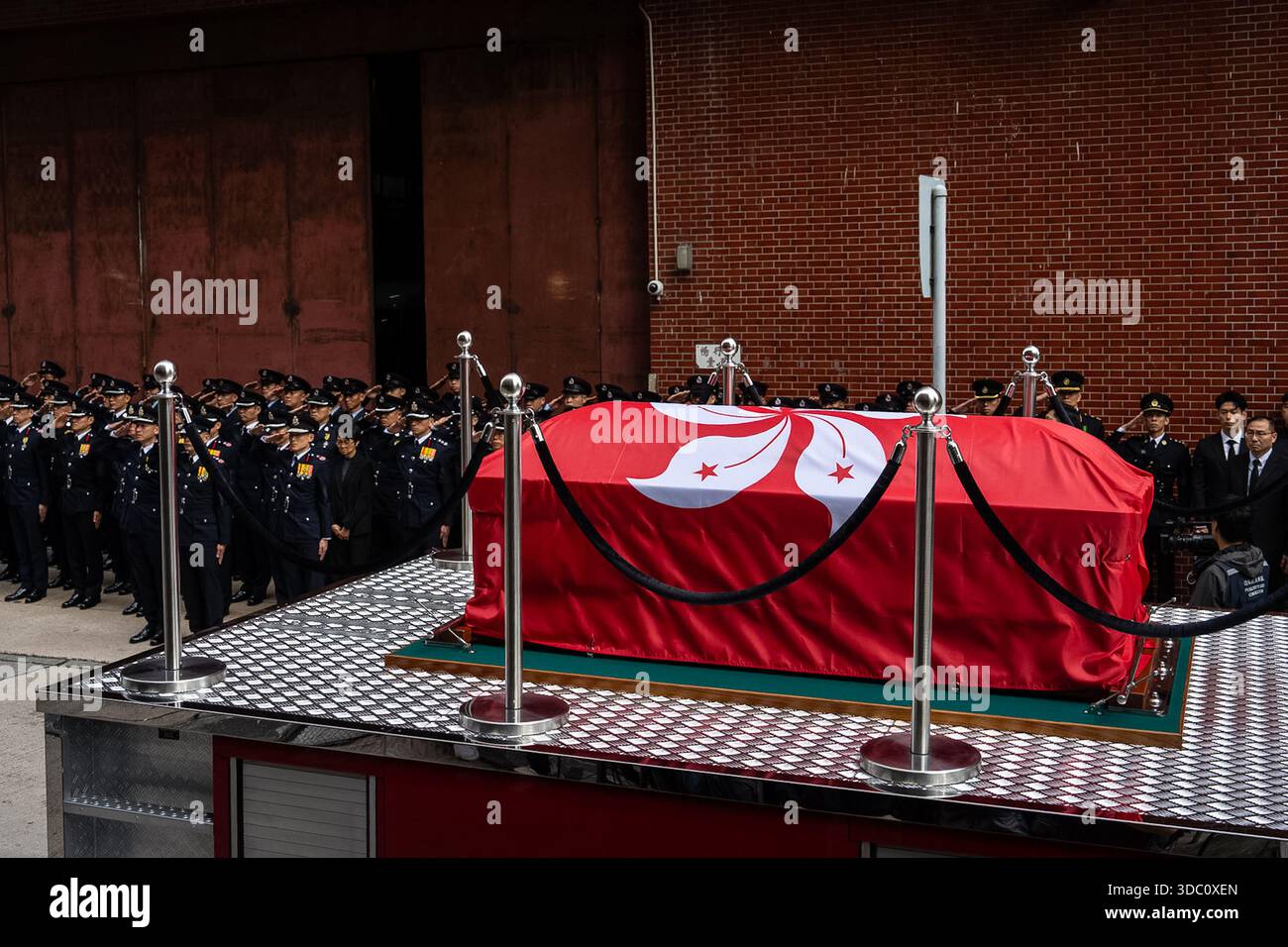 A hearse carries Ho Wai-ho, the firefighter who lost his life in the ...