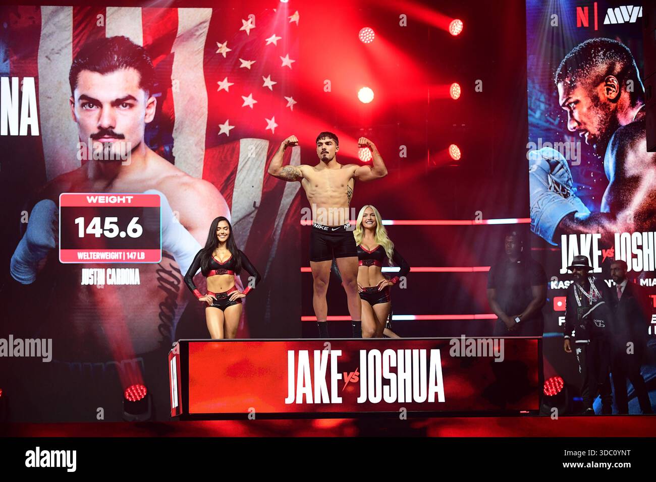 Justin Cardona flexes his muscles during the official weigh-in at the ...