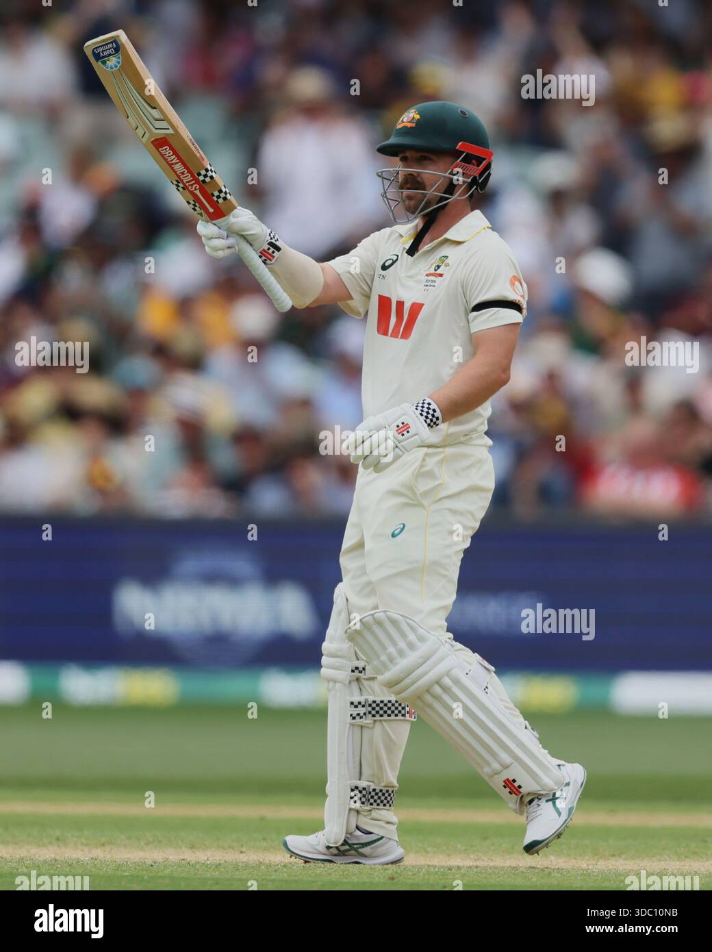 Australia's Travis Head reacts after scoring 50 runs during play on day ...