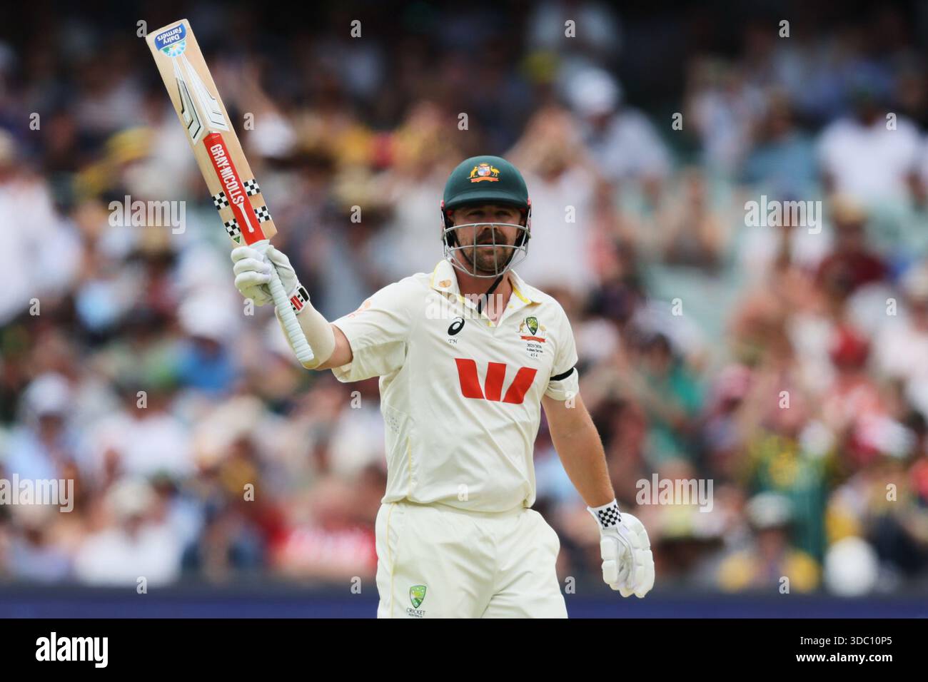 Australia's Travis Head reacts after scoring 50 runs during play on day ...