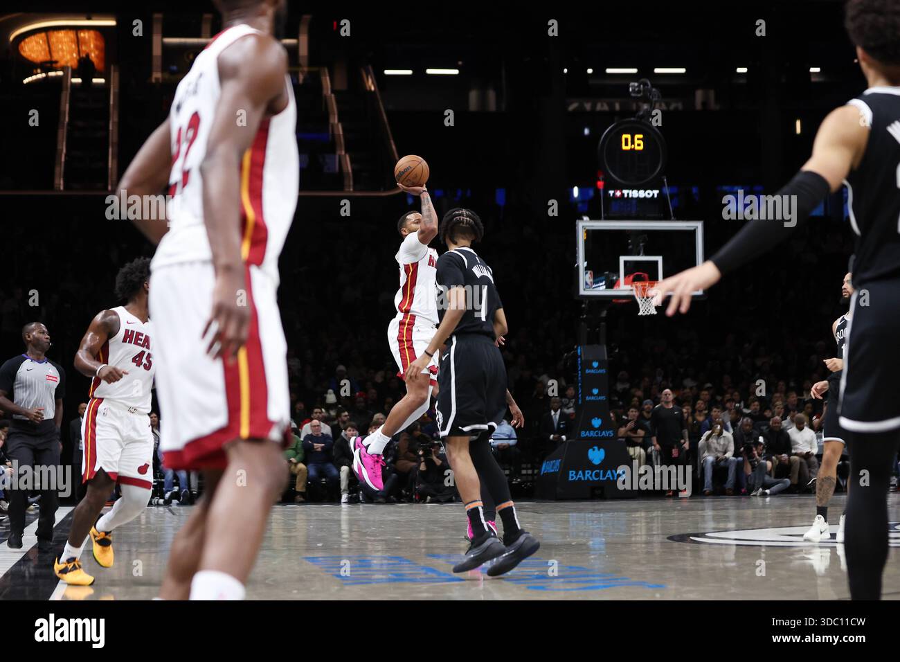 Miami Heat guard Norman Powell goes up to make a half-court shot over ...