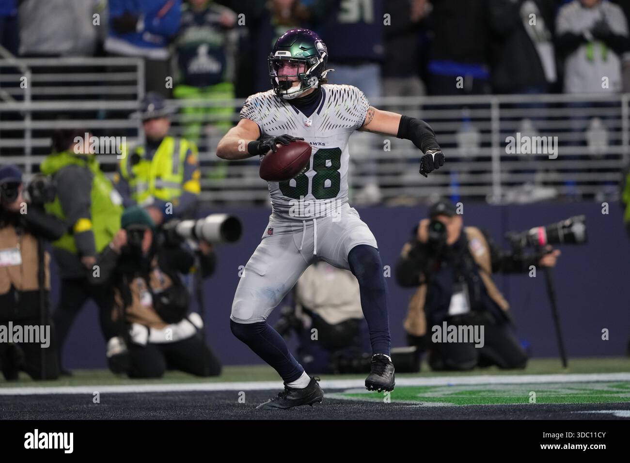 Seattle Seahawks tight end AJ Barner celebrates after scoring a ...